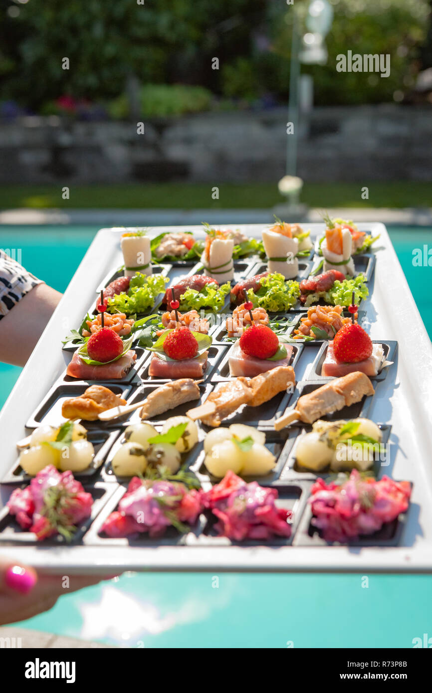 Small dishes on a plateau with a variety of fruits, vegetables, fish ...