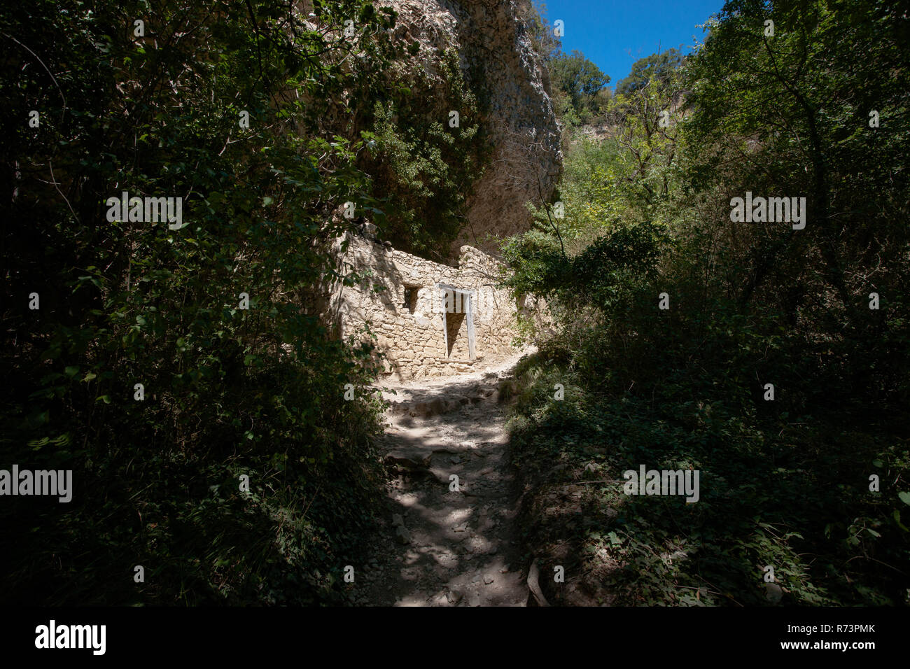 Old fallen slate built house in the mountains. A ruined ruin in the ...