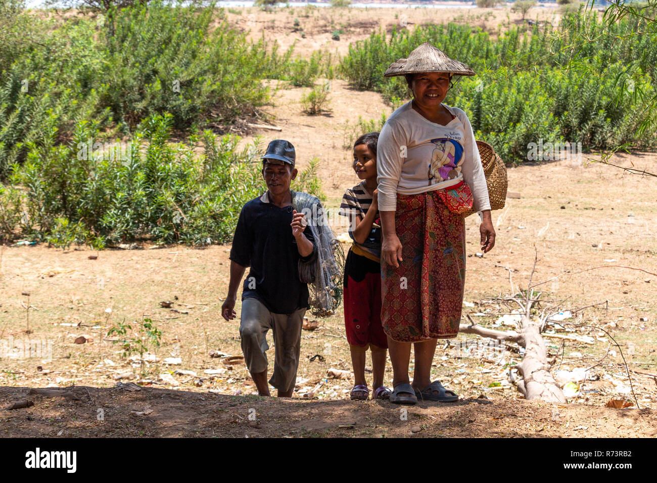 Don Daeng, Laos - April 27, 2018: Local family coming from fishing in ...