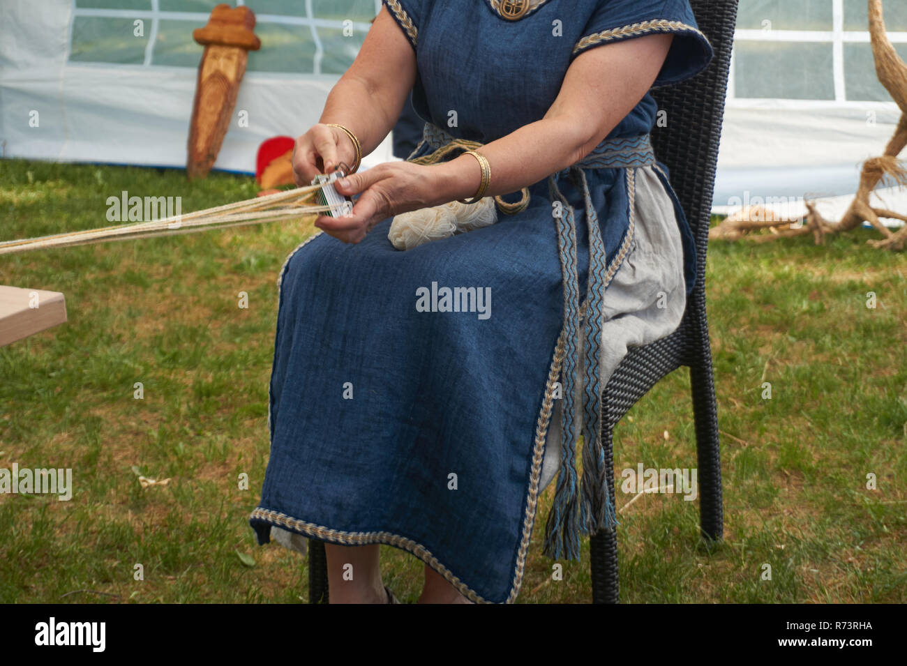 Woman in traditional clothing doing handicraft Stock Photo - Alamy