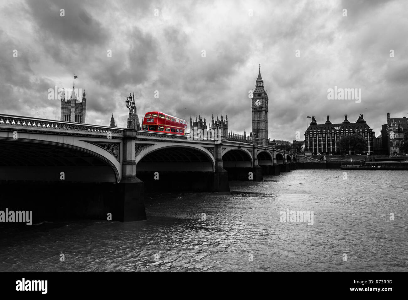 Classic London bus, crossing a bridge over the Tamesis river during a ...