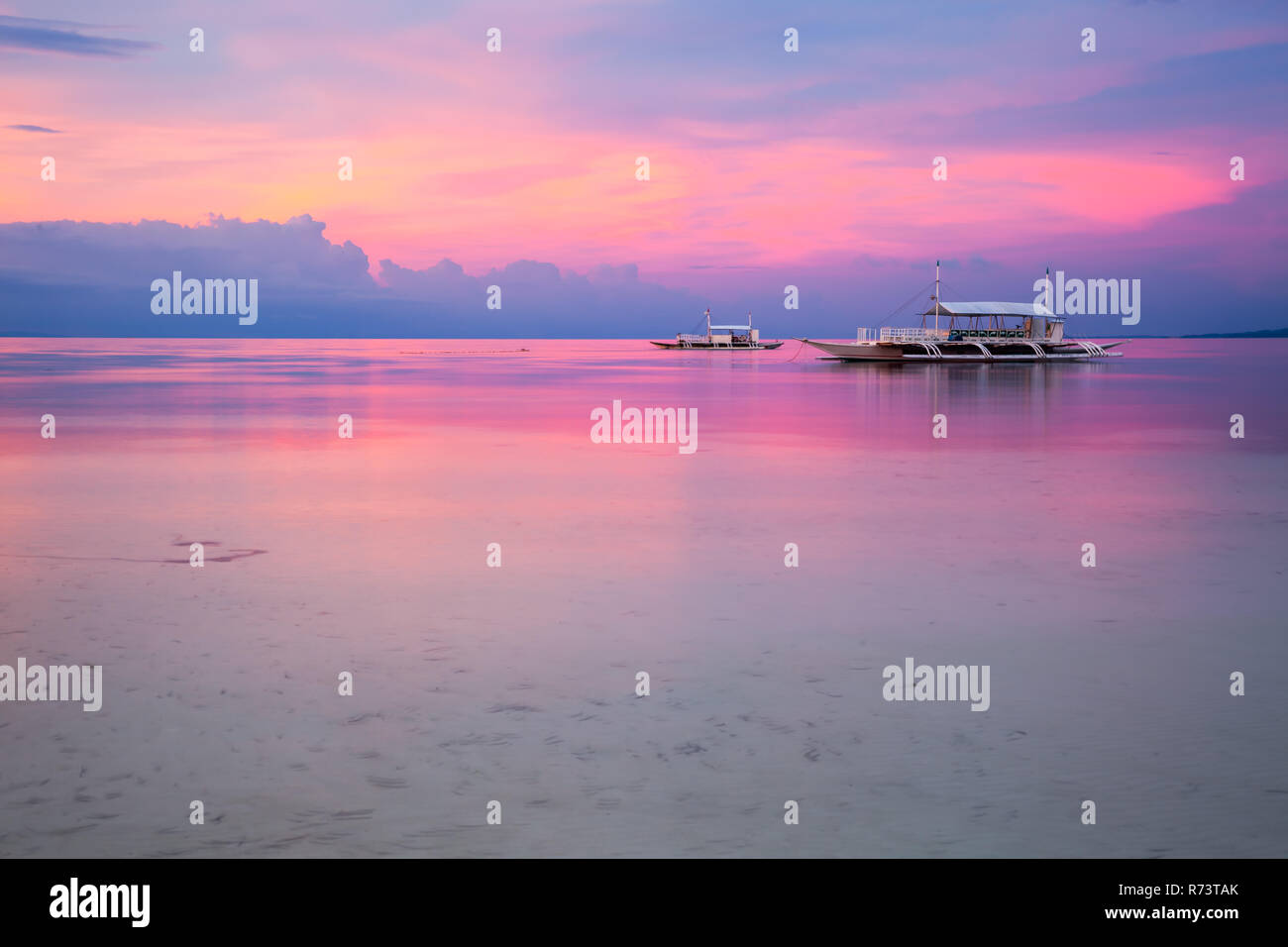 Stunning view of the sunset on the Philippine beach. Doljo beach ...