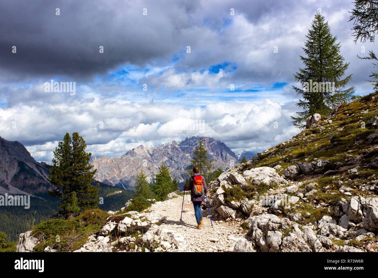 girl hiker at the mountains Dolomites, Italy. Cinque Torri Stock Photo ...