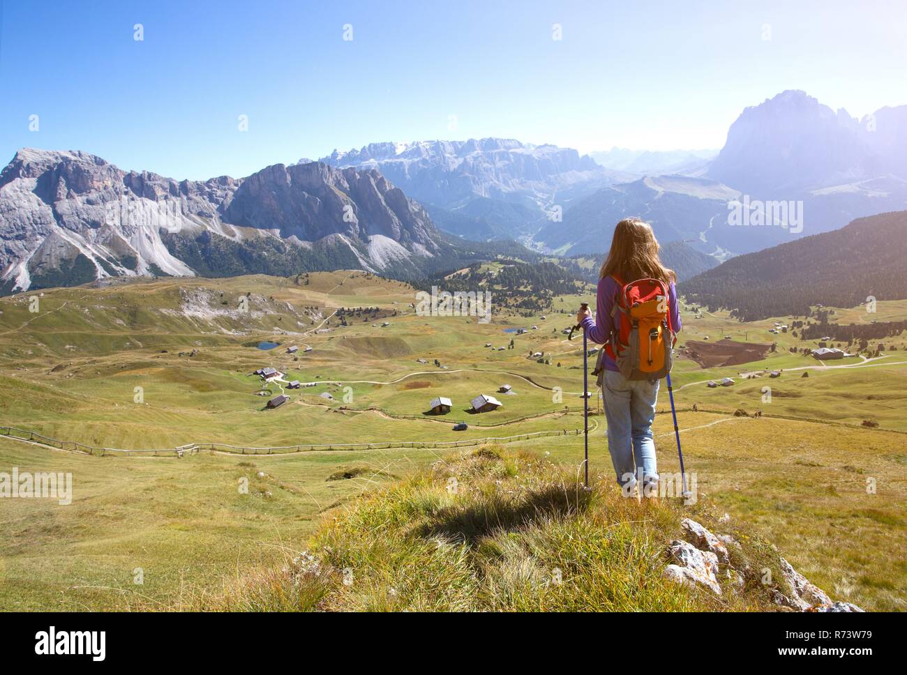 girl hiker at the mountains Dolomites and views of the valley, Italy ...