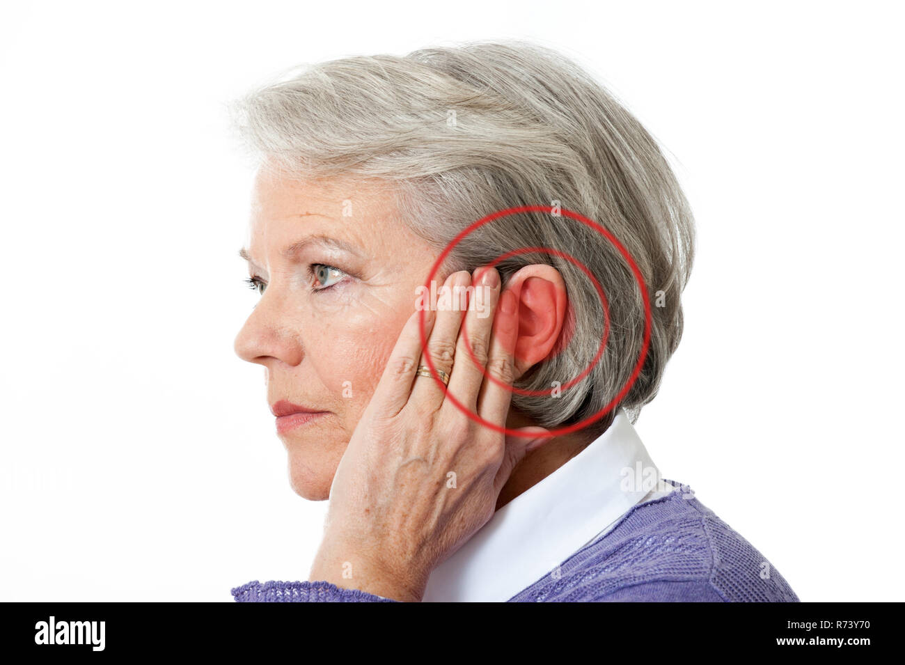 Mature woman with noise in the ear Stock Photo - Alamy