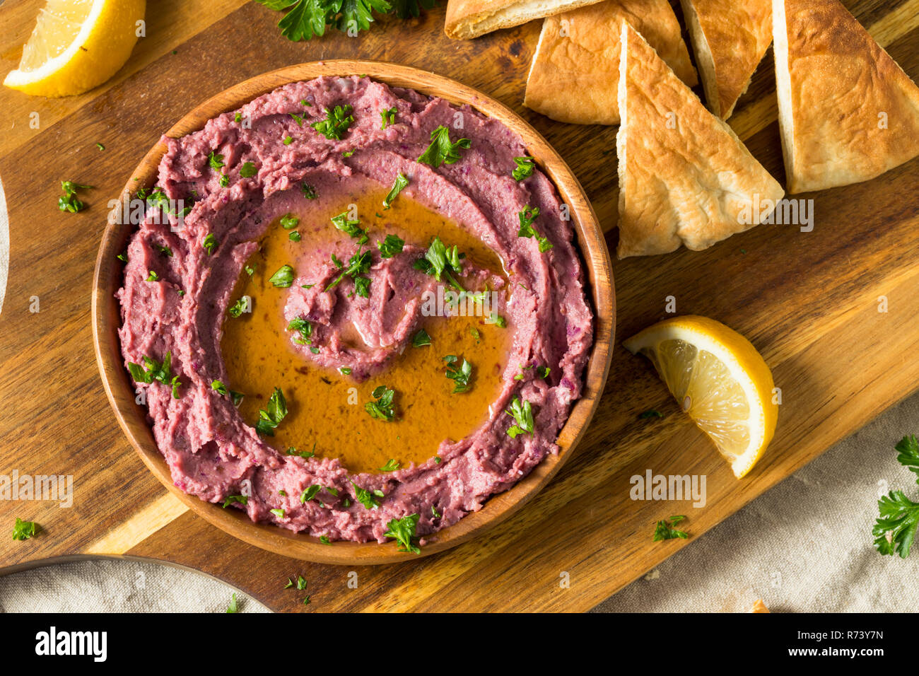 Homemade Purple Hummus with Olive Oil and Pita Chips Stock Photo - Alamy