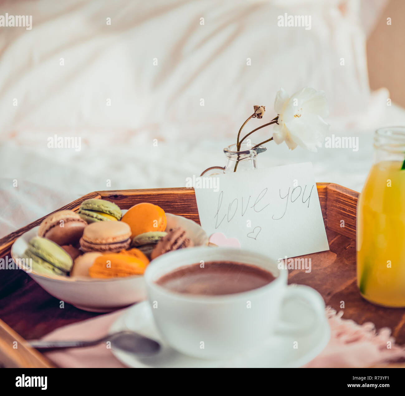 Breakfast in bed with i love you text on a note. Cup of coffee or cocoa ...