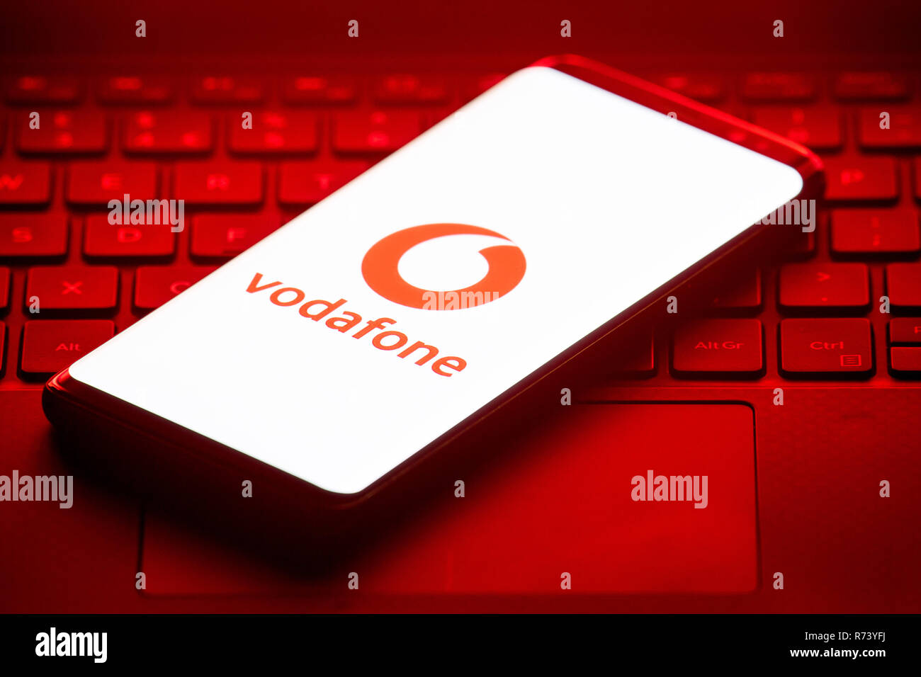 The logo of mobile phone network Vodafone is displayed on the screen of ...