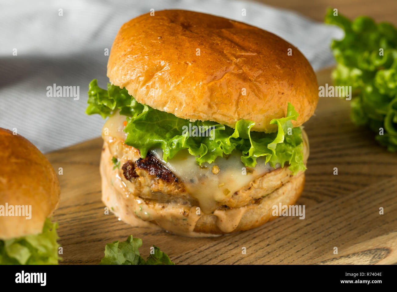 Spicy Homemade Chipotle Chicken Burger with Lettuce Stock Photo - Alamy