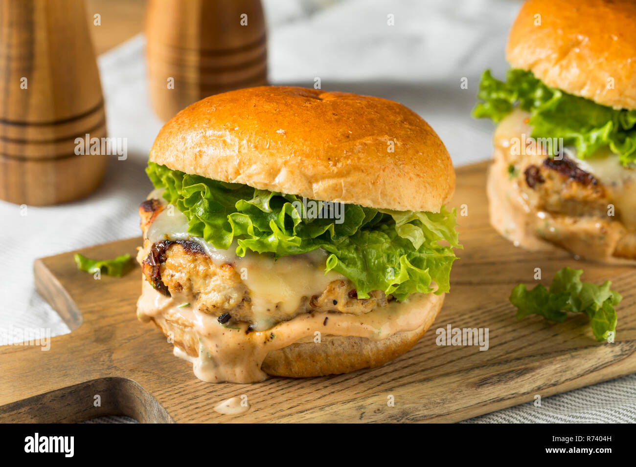 Spicy Homemade Chipotle Chicken Burger with Lettuce Stock Photo - Alamy