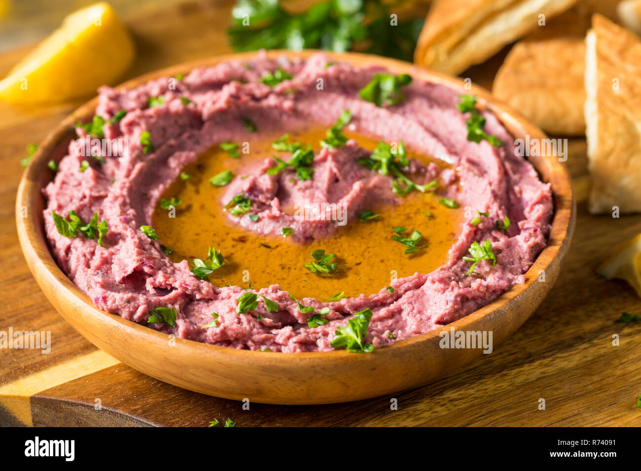 Homemade Purple Hummus with Olive Oil and Pita Chips Stock Photo - Alamy