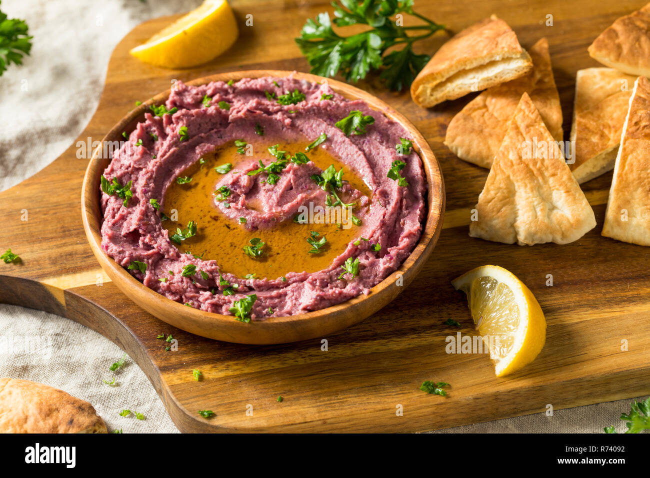 Homemade Purple Hummus with Olive Oil and Pita Chips Stock Photo - Alamy