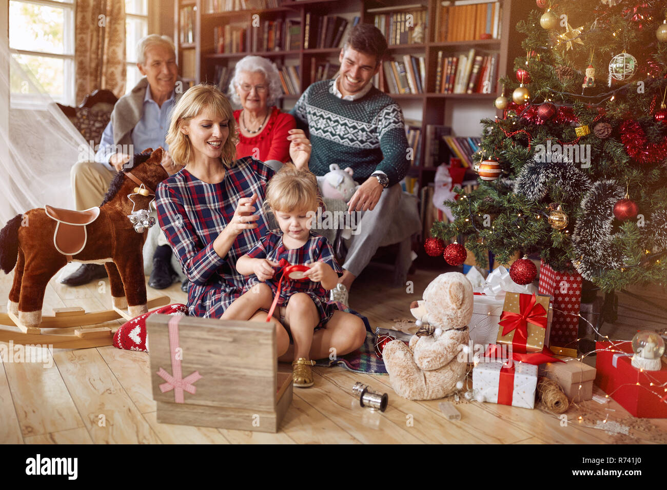 Christmas family portrait - Happy family in front of beautiful ...