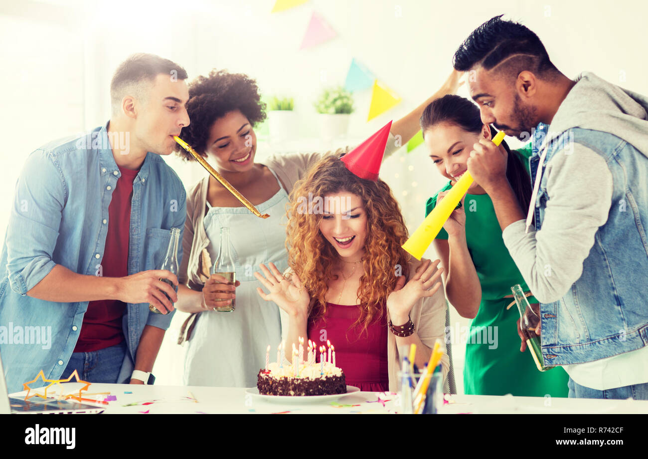 team greeting colleague at office birthday party Stock Photo - Alamy
