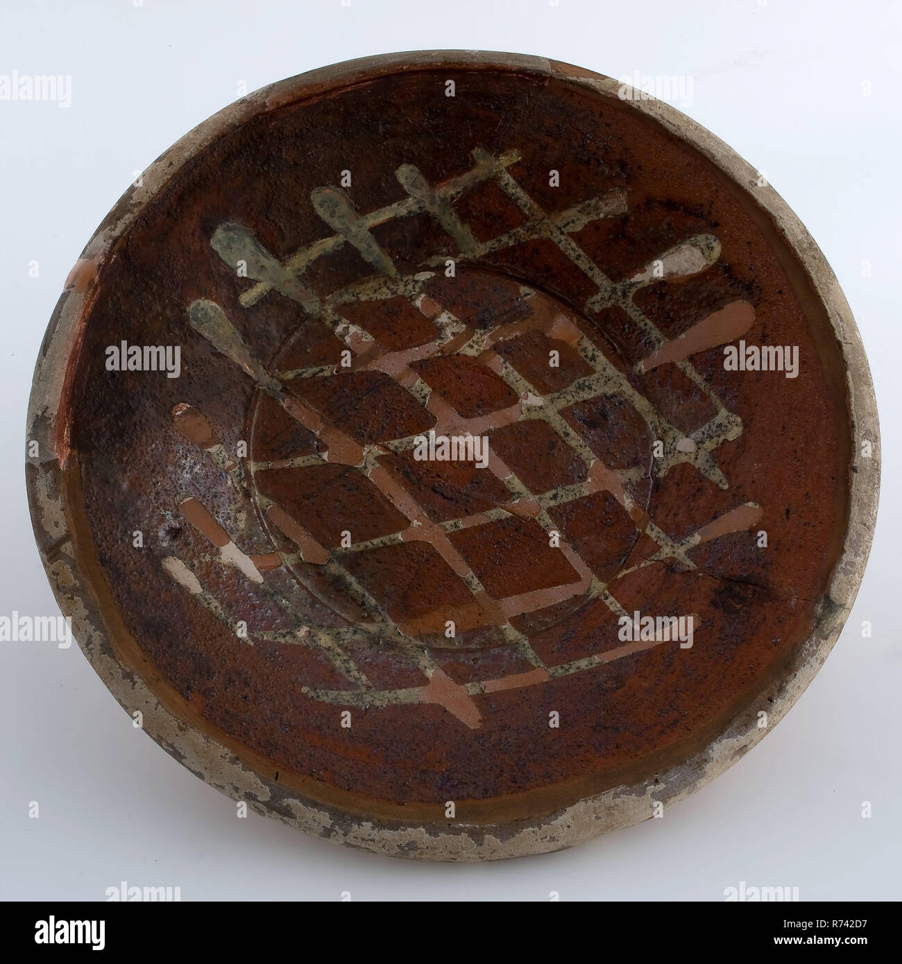 Earthenware plate with yellow waffle pattern in sludge technology ...