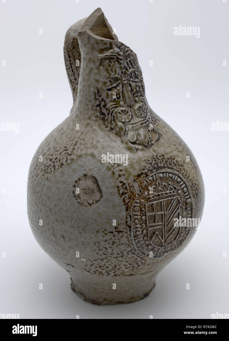 Gray-brown speckled Bartmann jug, also called Bellarmine jug, under ...
