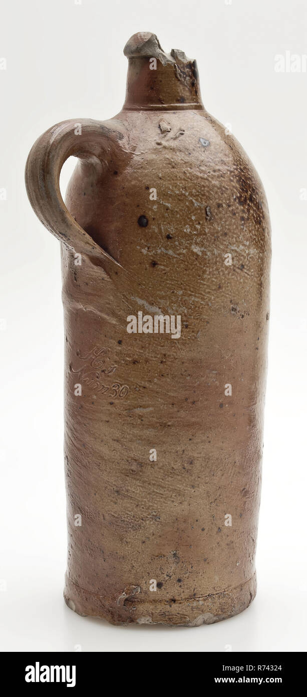 Stoneware cylindrical mineral pitcher with ear, brown glazed and marked ...