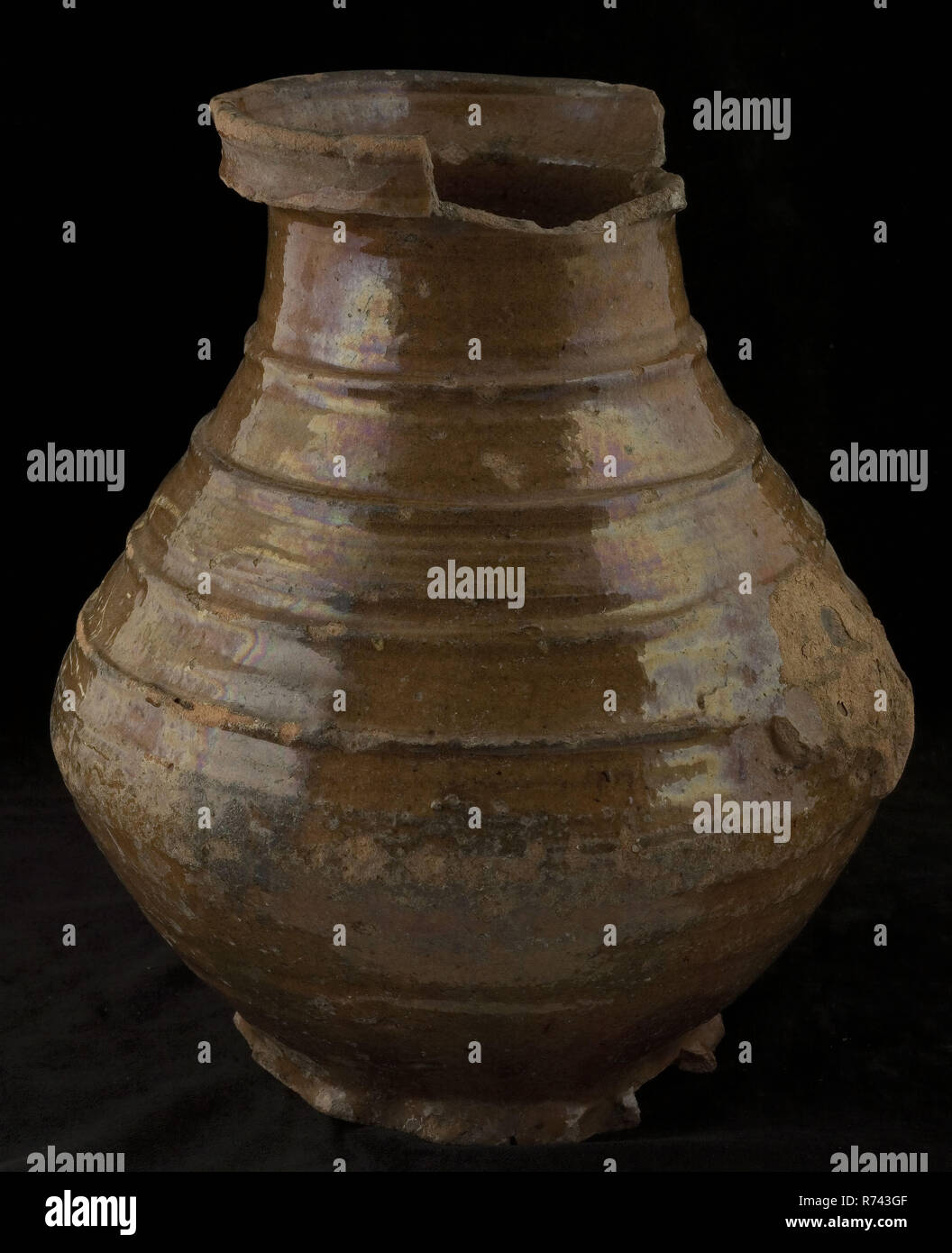 Pottery jug be placed on pinched stand with large rotations on the ...