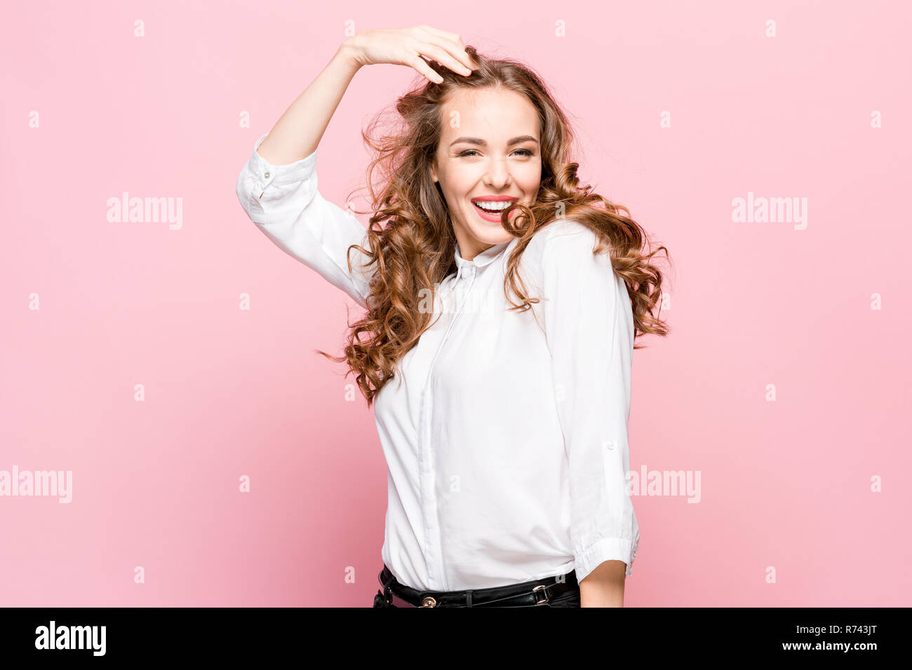 The young woman's portrait with happy emotions on pink background Stock ...