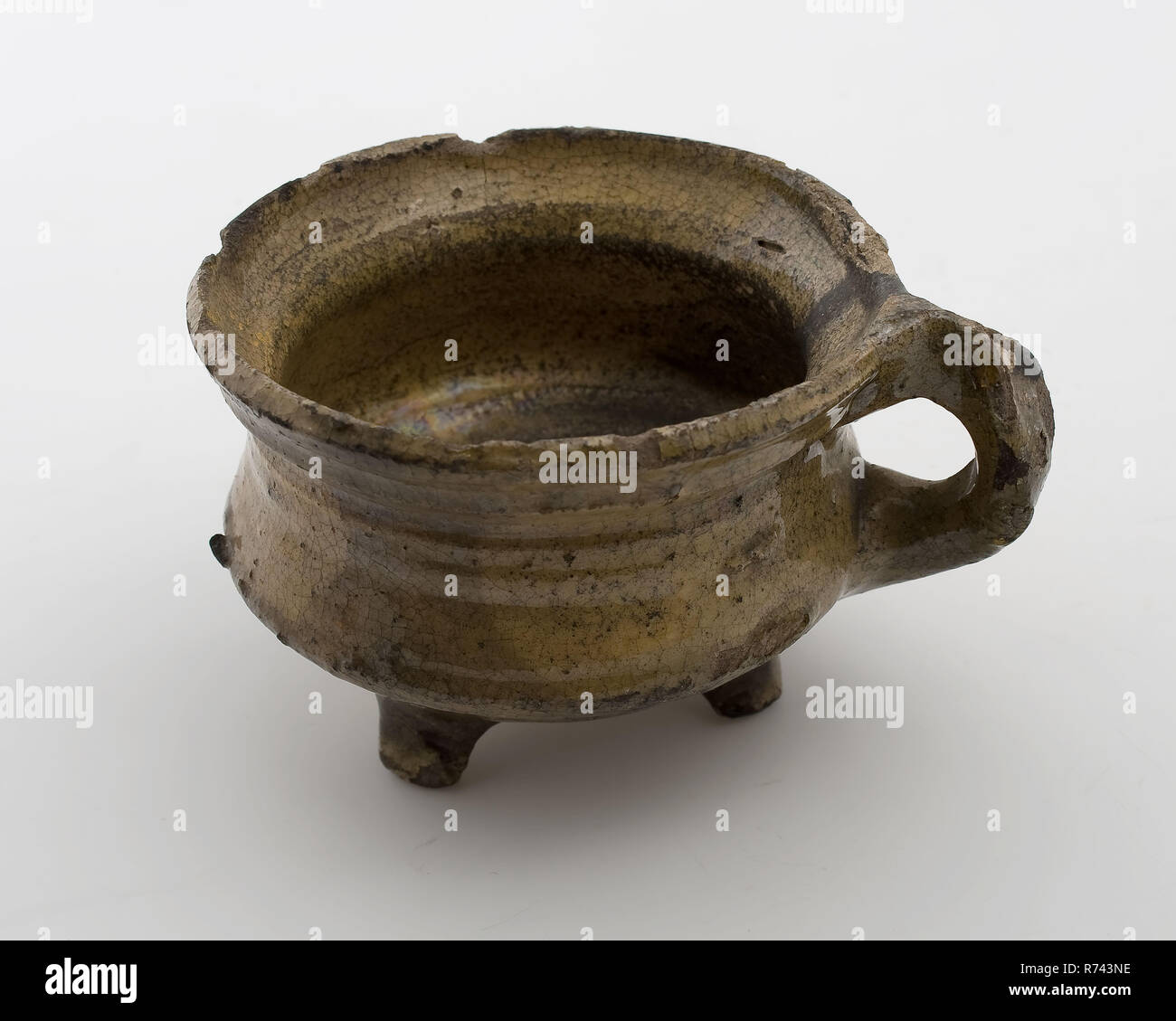 Pottery toy cooking pot, with white shard with yellow lead glaze ...