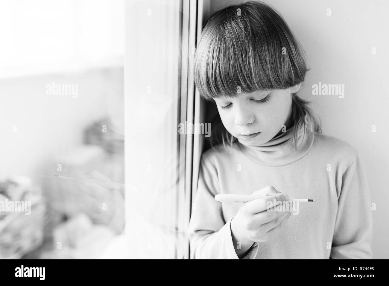 Sick boy lying on bed Black and White Stock Photos & Images - Alamy