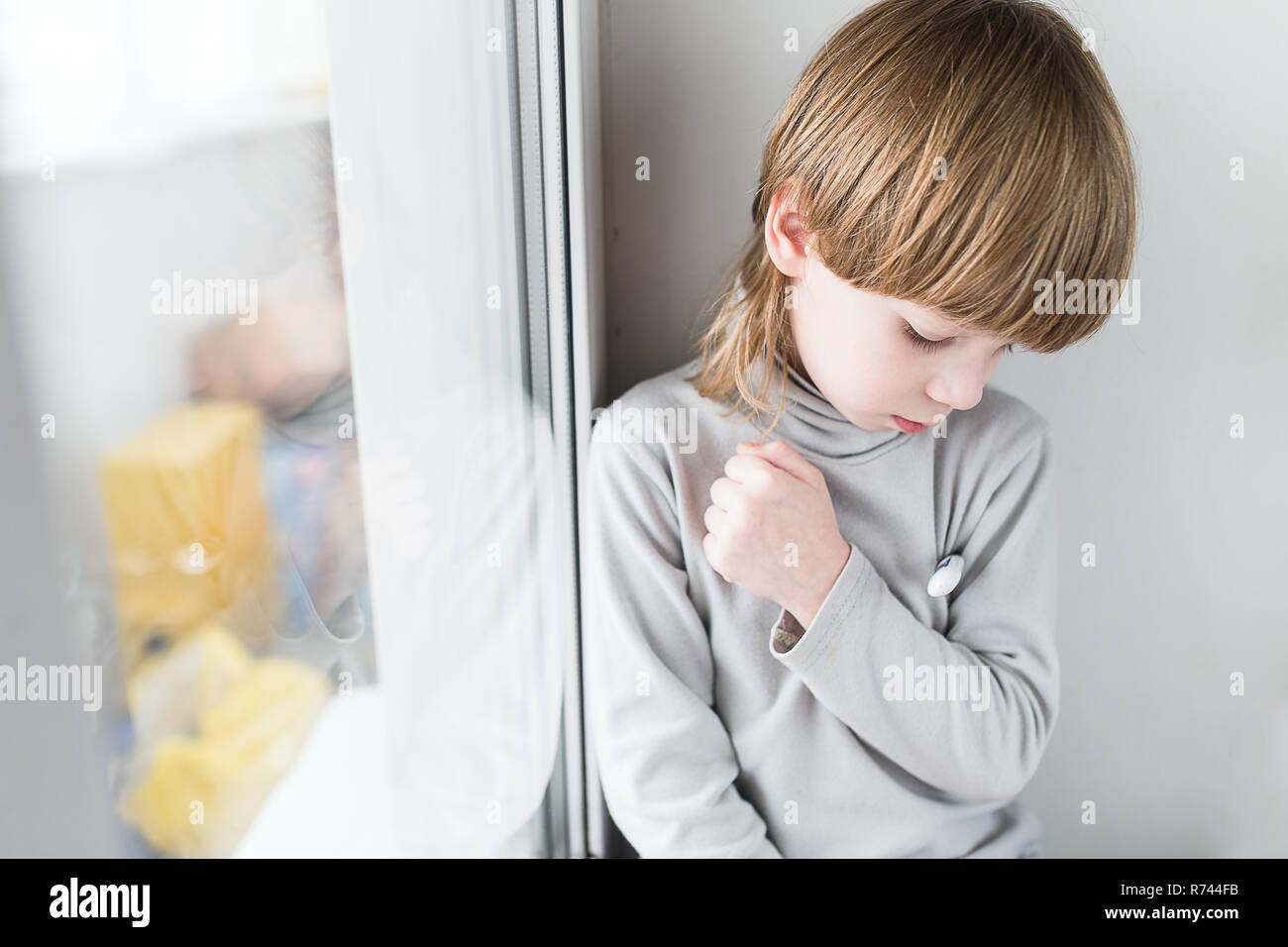 Child boy thermometer measures temperature. High temperature on the ...