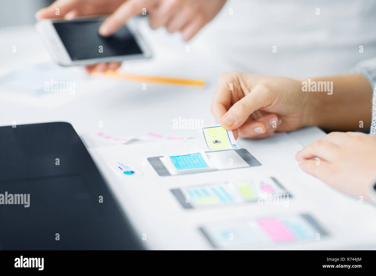 web designers creating mobile user interface Stock Photo - Alamy