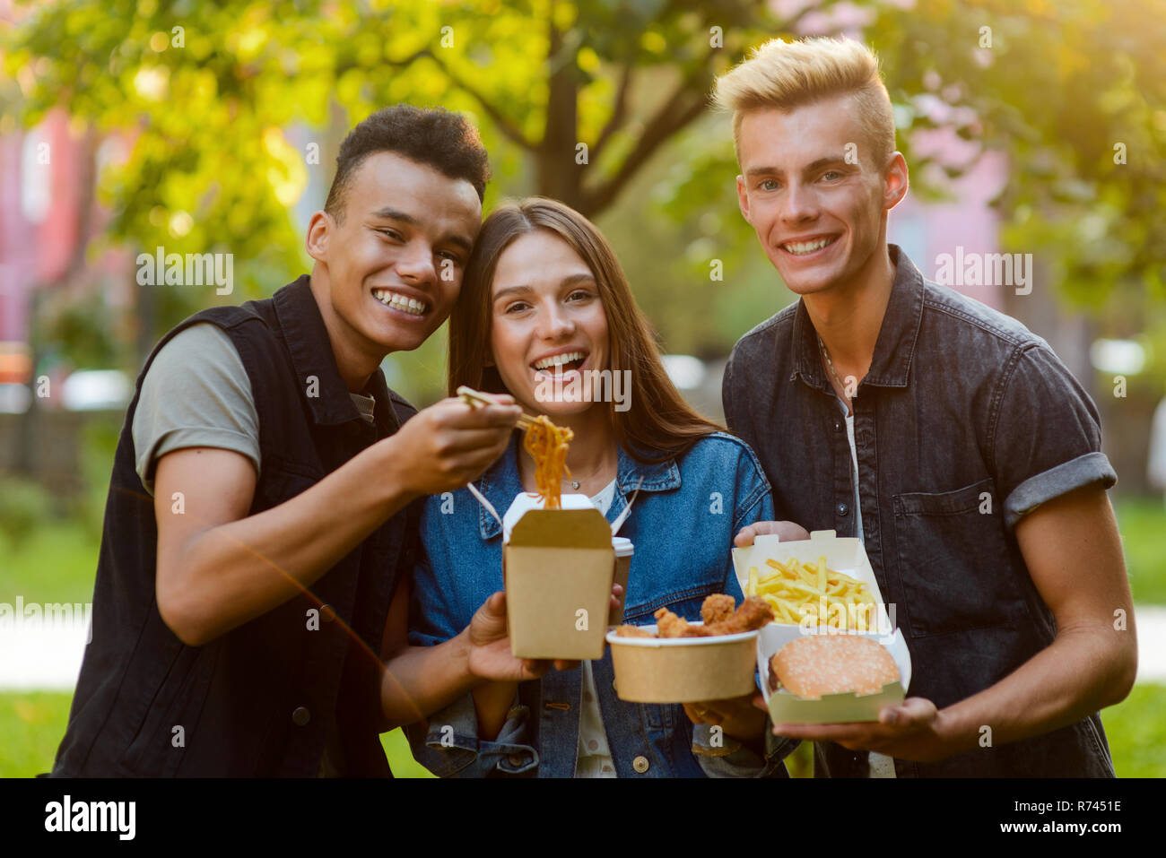 Happy three friends Stock Photo - Alamy