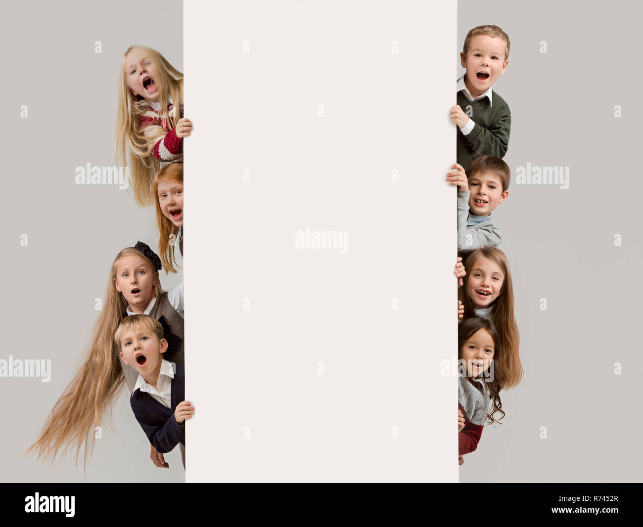 Banner with a surprised children peeking at the edge with copyspace ...