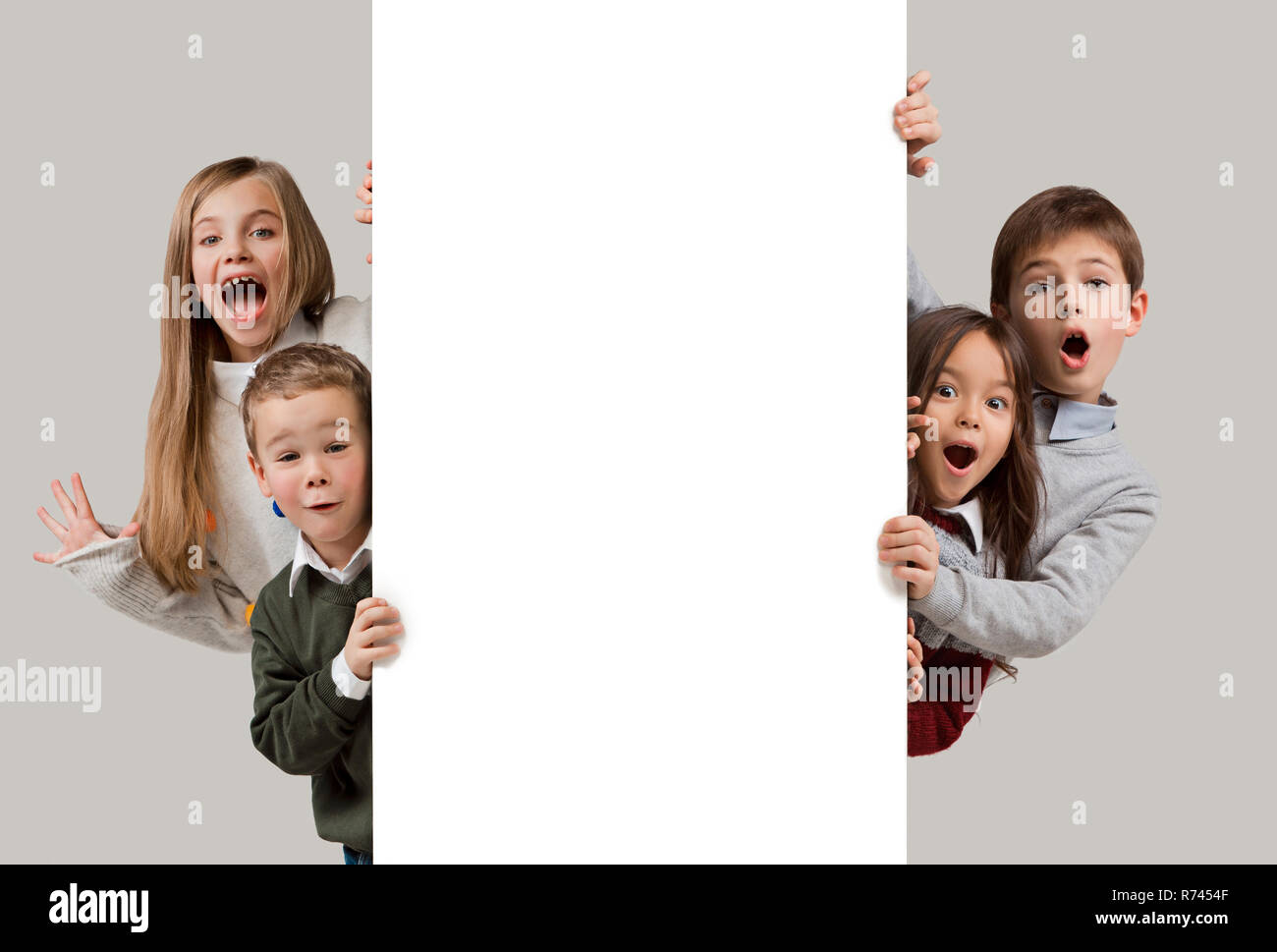 Banner with a surprised children peeking at the edge with copyspace ...