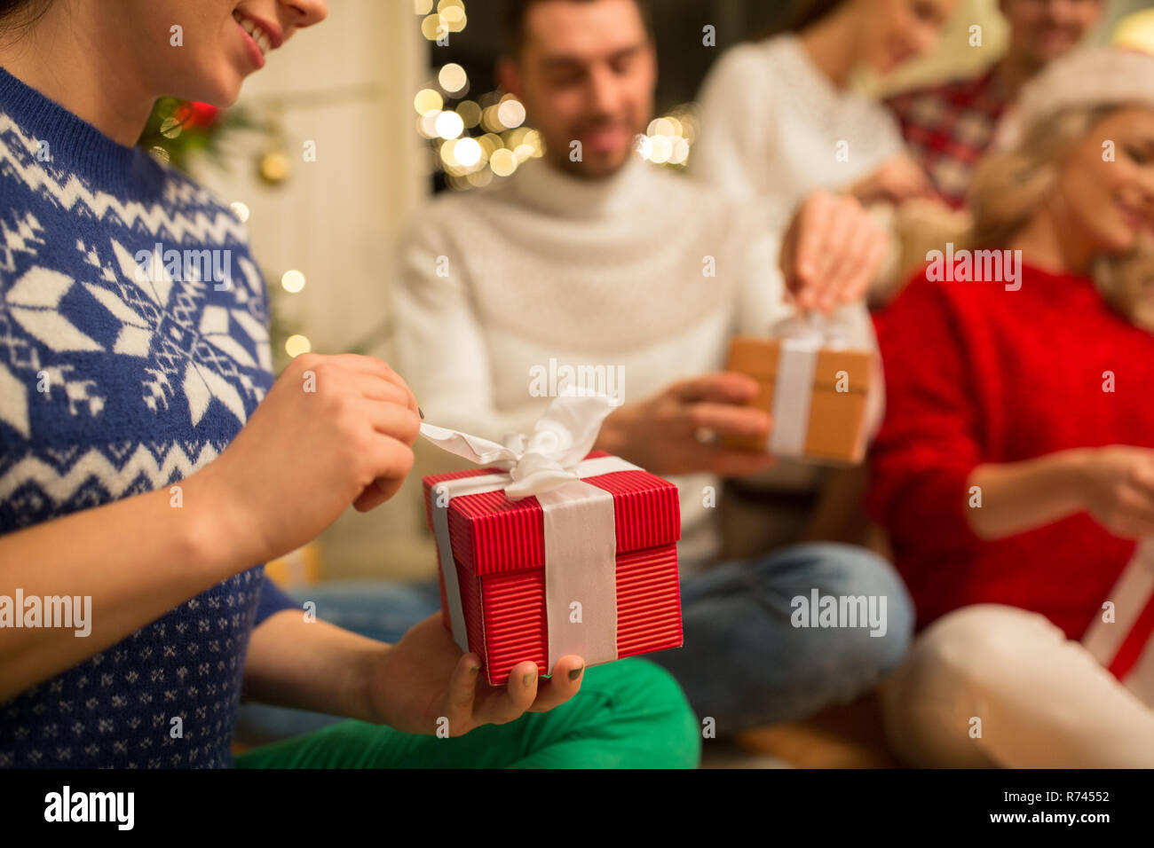 Happy family opening gifts hi-res stock photography and images - Alamy