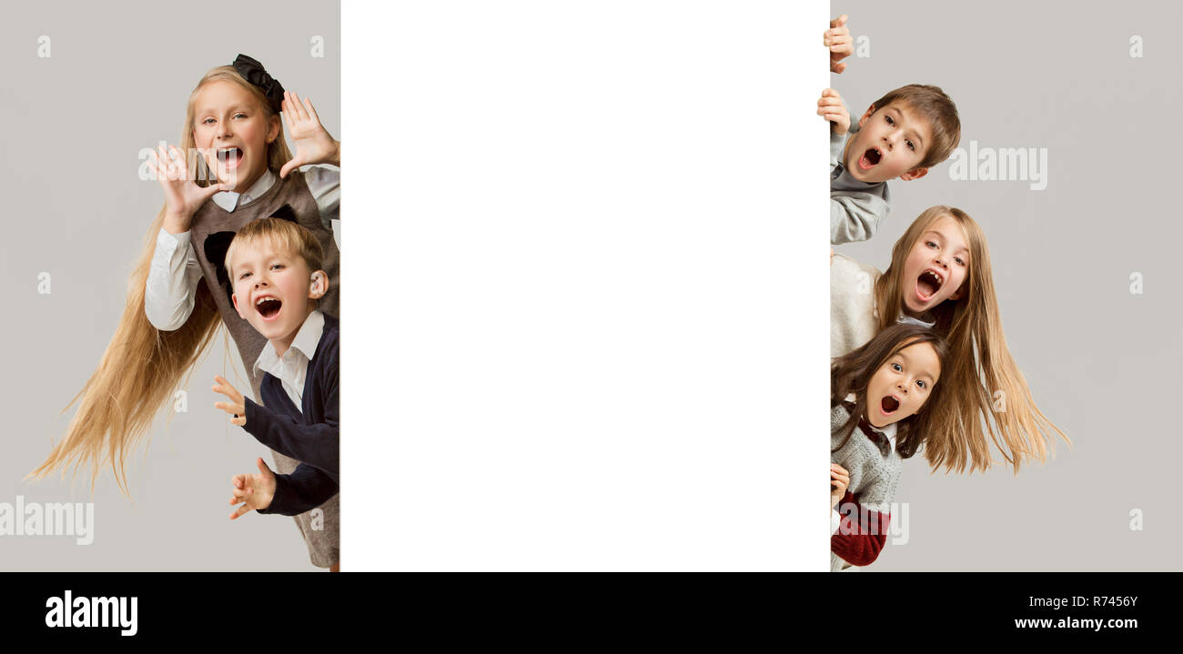 Banner with a surprised children peeking at the edge with copyspace ...