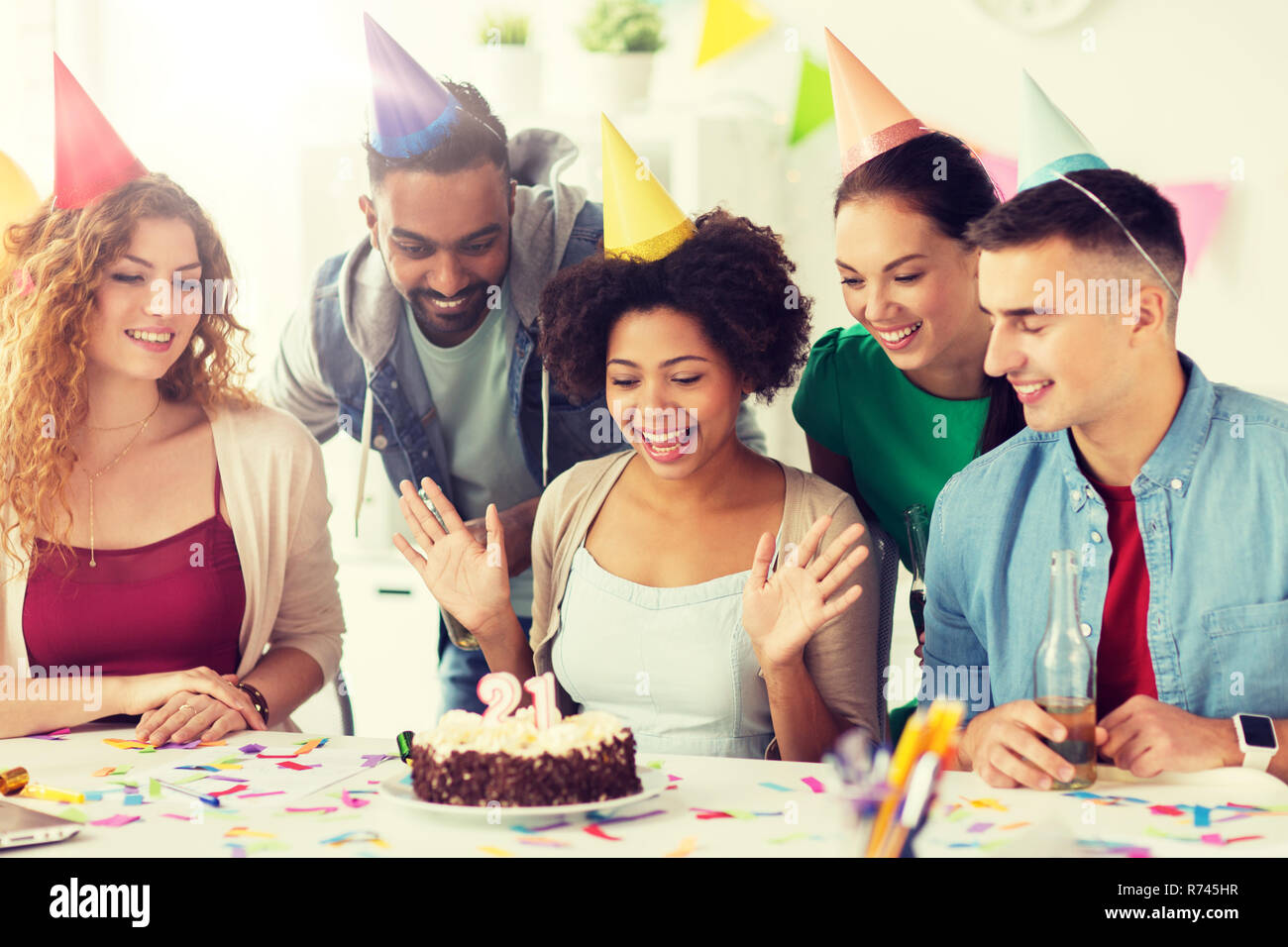 team greeting colleague at office birthday party Stock Photo - Alamy