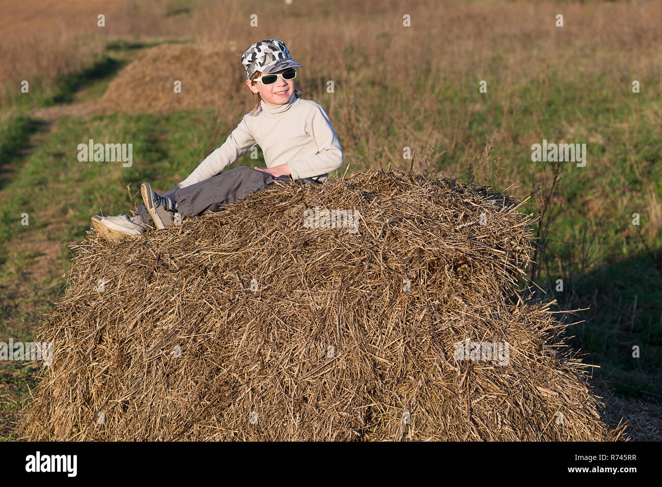 Girl lying on haystack hi-res stock photography and images - Alamy