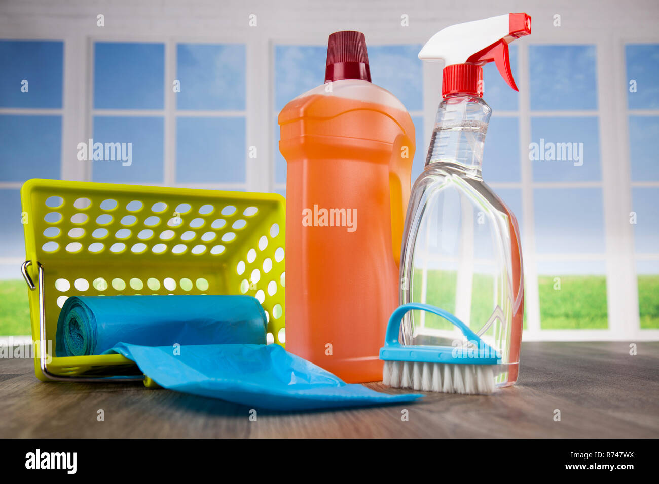 House cleaning product on wood table and window background Stock Photo ...