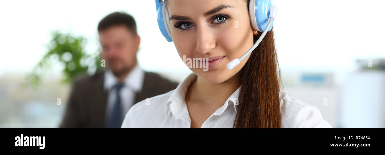 Beautiful brunette smiling call centre clerk at work Stock Photo - Alamy