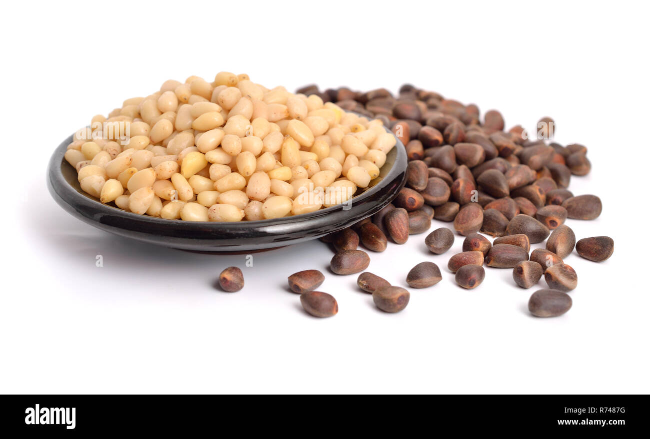 Shelled pine nuts with oil. Isolated on white background Stock Photo ...