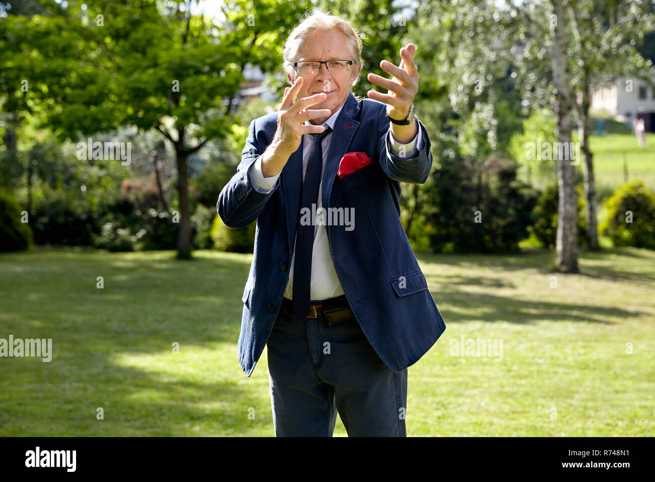 Gesticulate man in the garden Stock Photo - Alamy