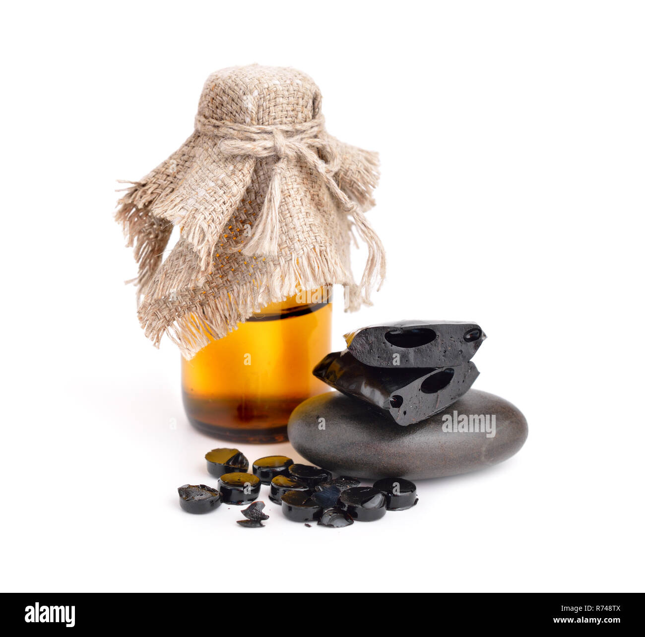 Shilajit, Mumijo. Tablets and solution isolated on white background ...