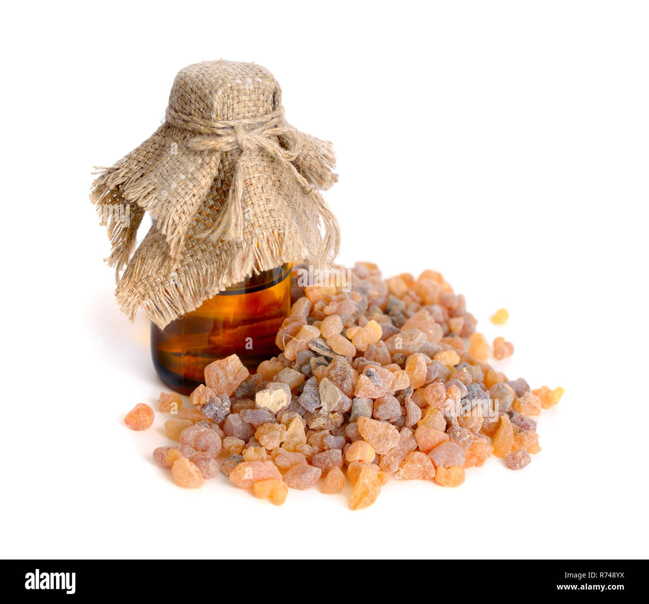 Frankincense olibanum resin with pharmaceutical bottle. Isolated on ...