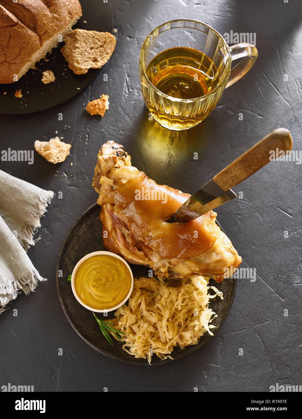 Roasted pork knuckle (eisbein) with braised cabbage (sauerkraut) and ...