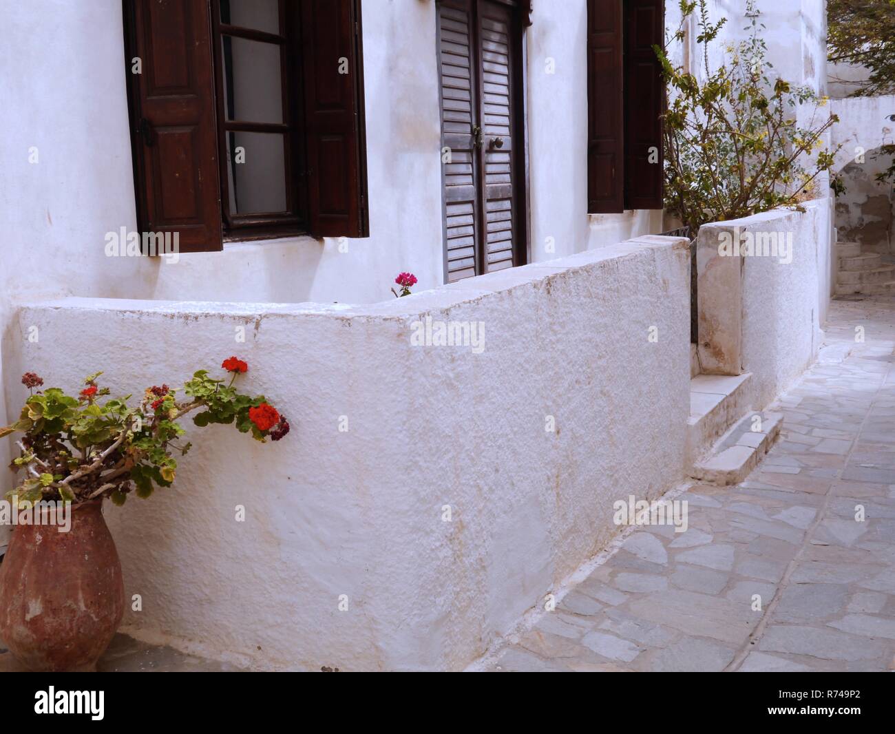 Traditional Whitewashed Greek Home with Wooden Door and Wood Window ...