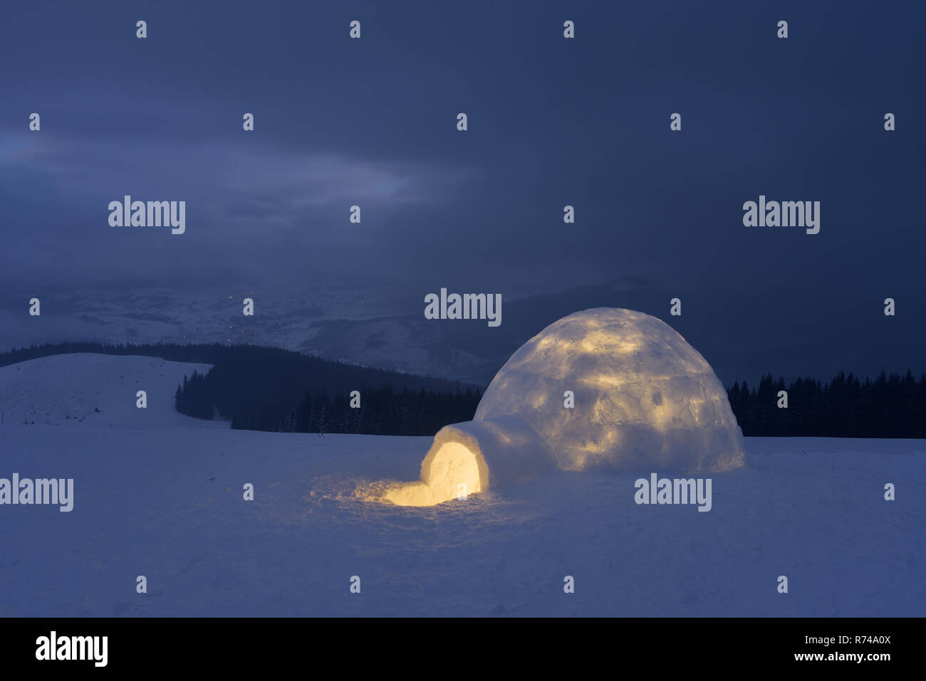 Night landscape. Snow igloo in mountains. Extreme housing for tourists ...
