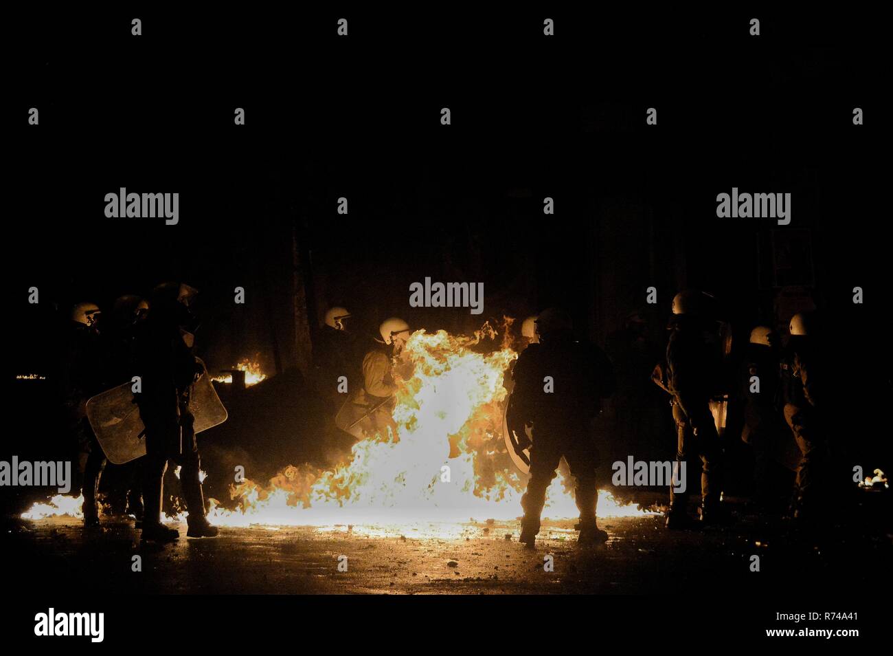 Riot policemen seen as gas bombs explode during the riots. Anarchists ...