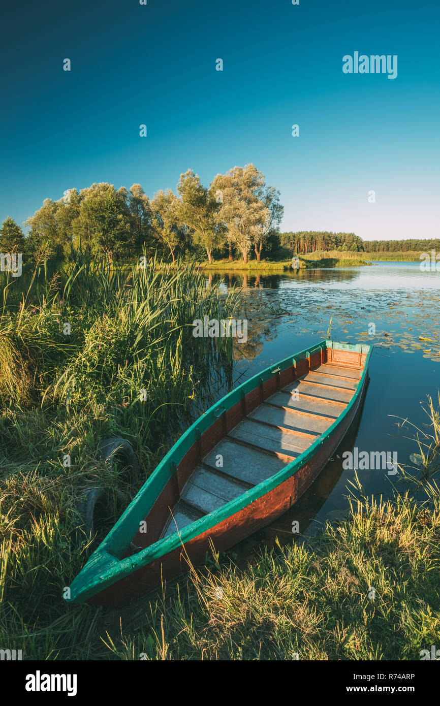 Old Wooden Rowing Fishing Boat Near Lake Or River Coast At Beautiful ...