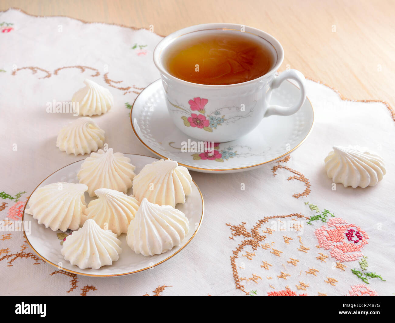 Still life with tea and a meringue Stock Photo - Alamy