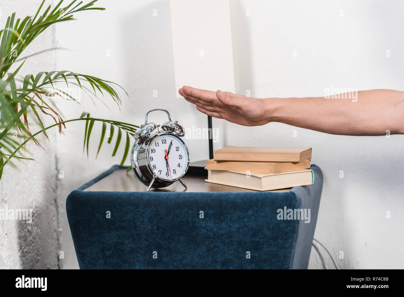 Hand turning off alarm clock hi-res stock photography and images - Alamy