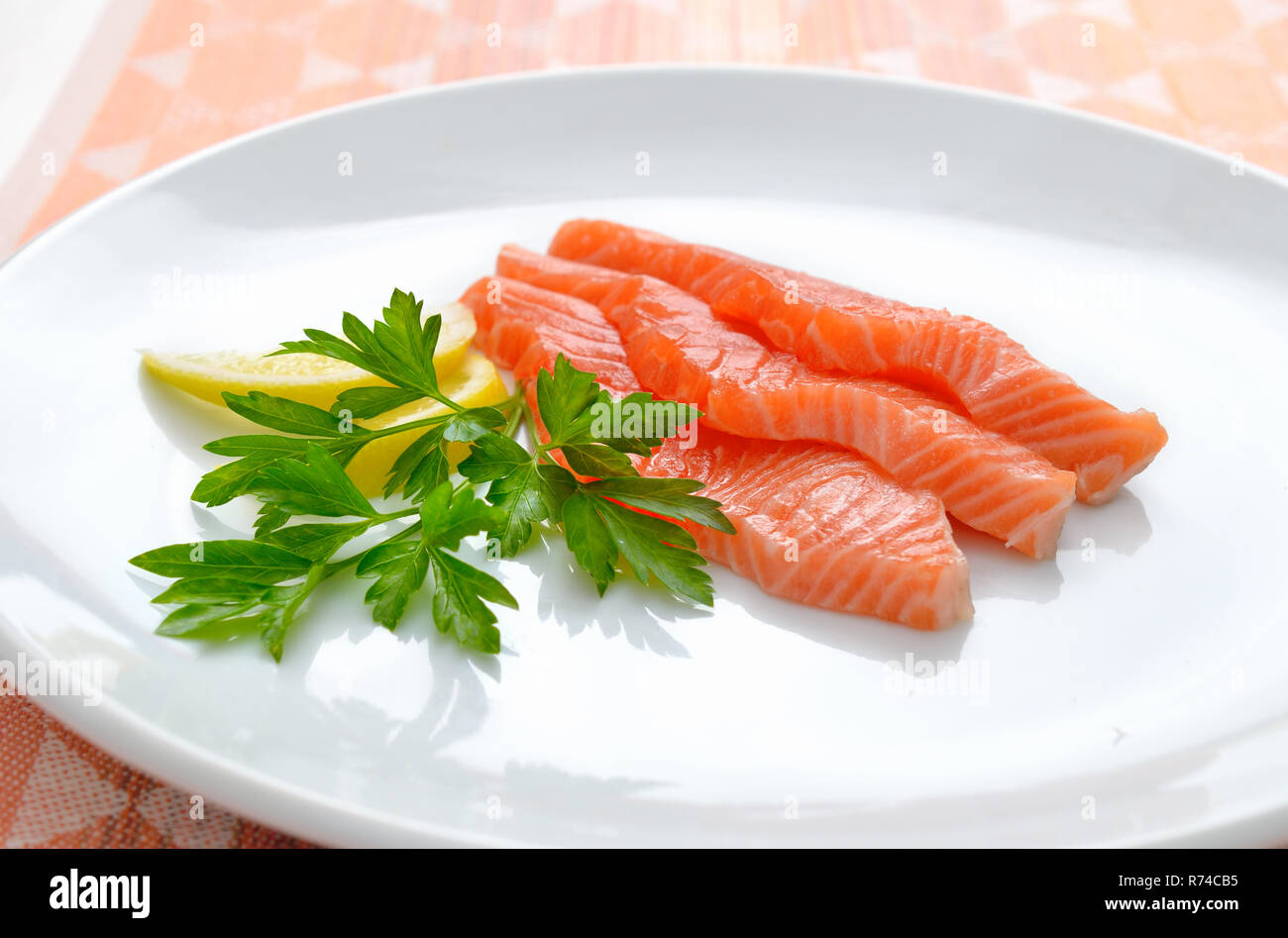Salmon on white plate Stock Photo - Alamy
