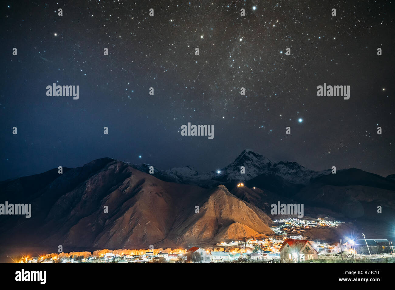 Stepantsminda, Georgia. Natural Real Night Starry Sky With Glowing ...
