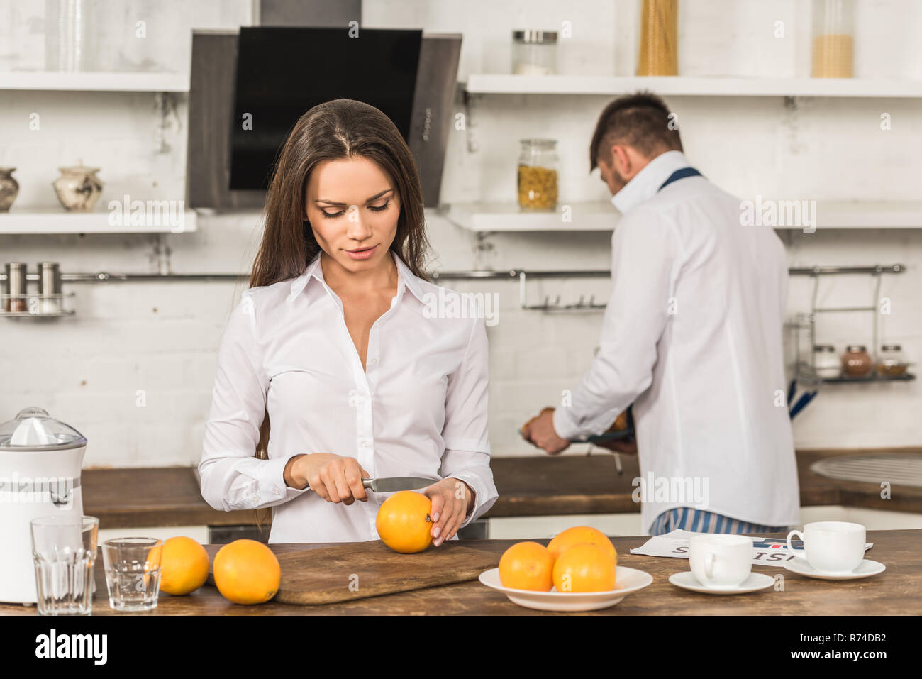 boyfriend and girlfriend preparing breakfast on weekday, gender ...